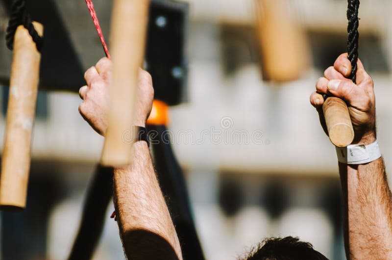 An Athlete S Powerful Hands Tackling a Monkey Bar or Peg Board Obstacle ...