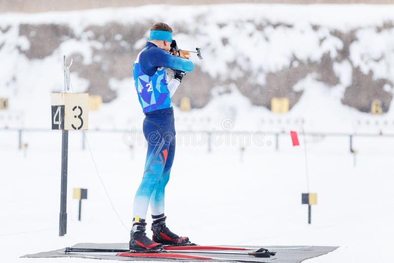 Athlete Shooting in Standing Position at the Range in a Biathlon ...