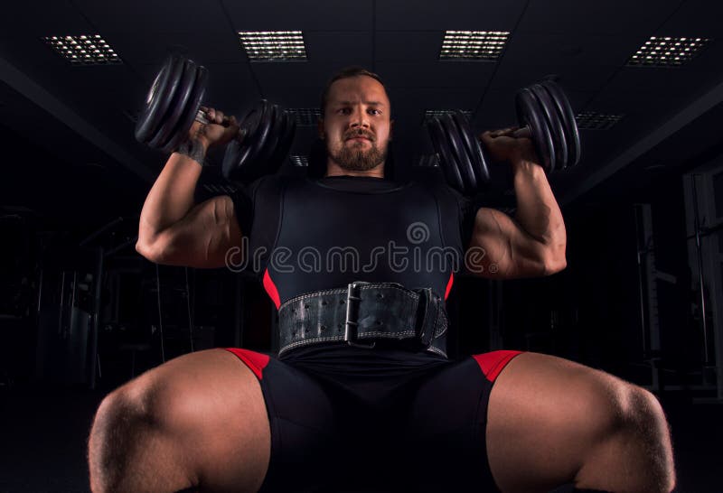 The Athlete Sits on a Bench and Does an Exercise Called Military Stock ...