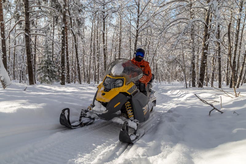 Athlete on a snowmobile stock image. Image of transportation - 84403137