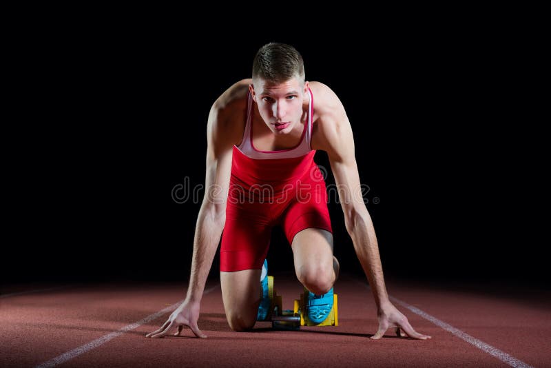 Athlete on the Starting Blocks with Hurdles Stock Photo - Image of ...