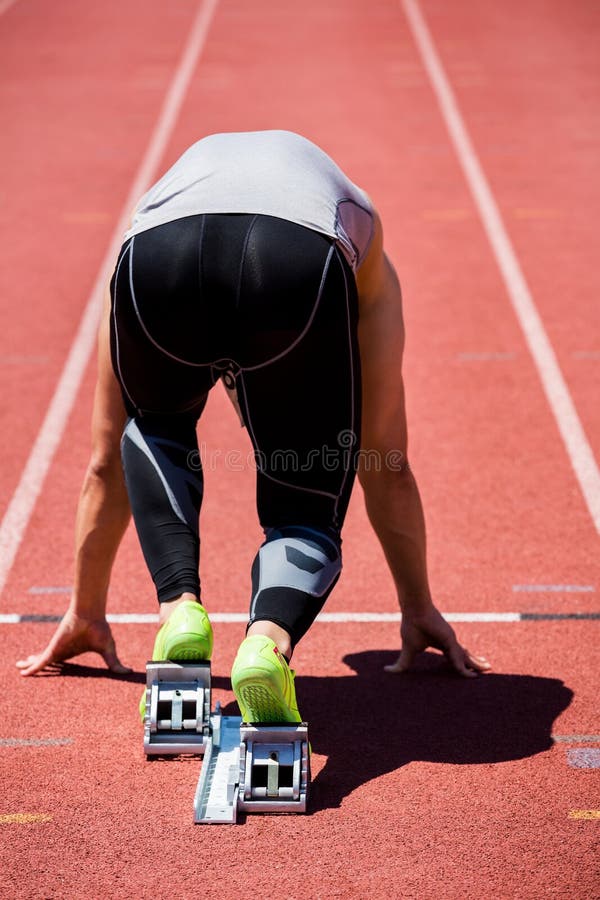 Athlete on a Starting Block about To Run Stock Photo - Image of sports ...