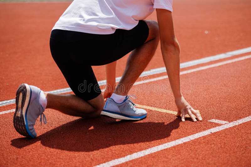 Athlete in Starting Position on Running Track Stock Photo - Image of ...