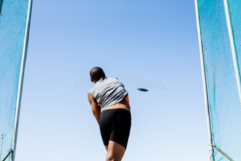 Athlete Throwing Discus in Stadium Stock Image - Image of determination ...