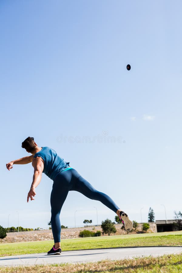Athlete Throwing Discus in Stadium Stock Image - Image of stadium ...