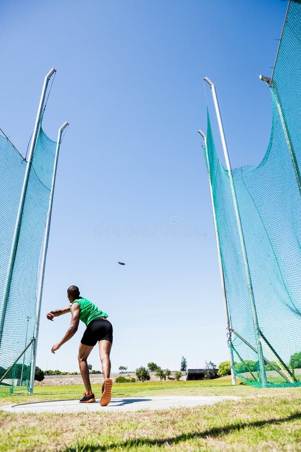 Athlete Throwing Discus in Stadium Stock Image - Image of fitness ...
