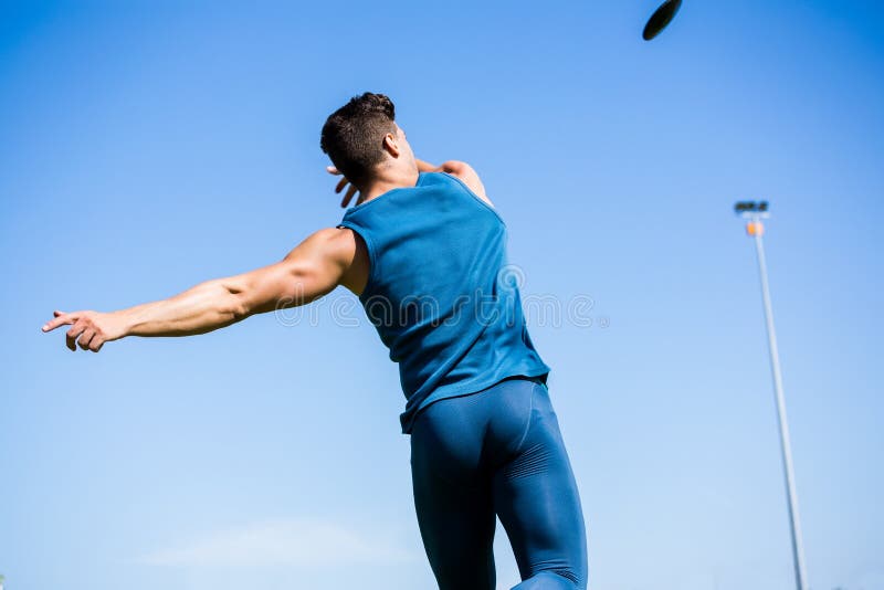 Athlete Throwing Discus in Stadium Stock Photo - Image of athletic ...