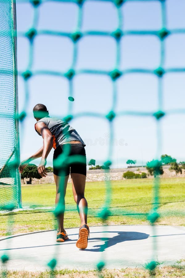 Athlete Throwing Discus in Stadium Stock Image - Image of discus, male ...