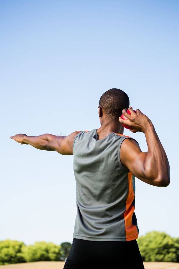 Athlete about To Throw Shot Put Ball Stock Image - Image of holding ...