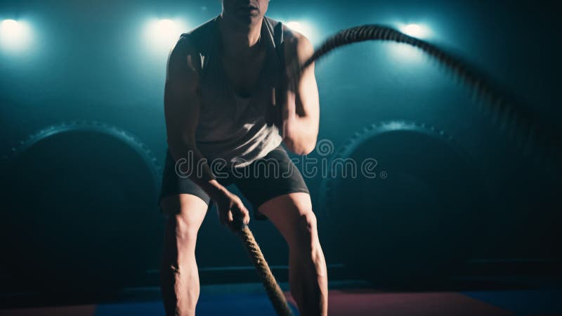Athlete Training Using Battle Ropes Stock Photo - Image of strength ...