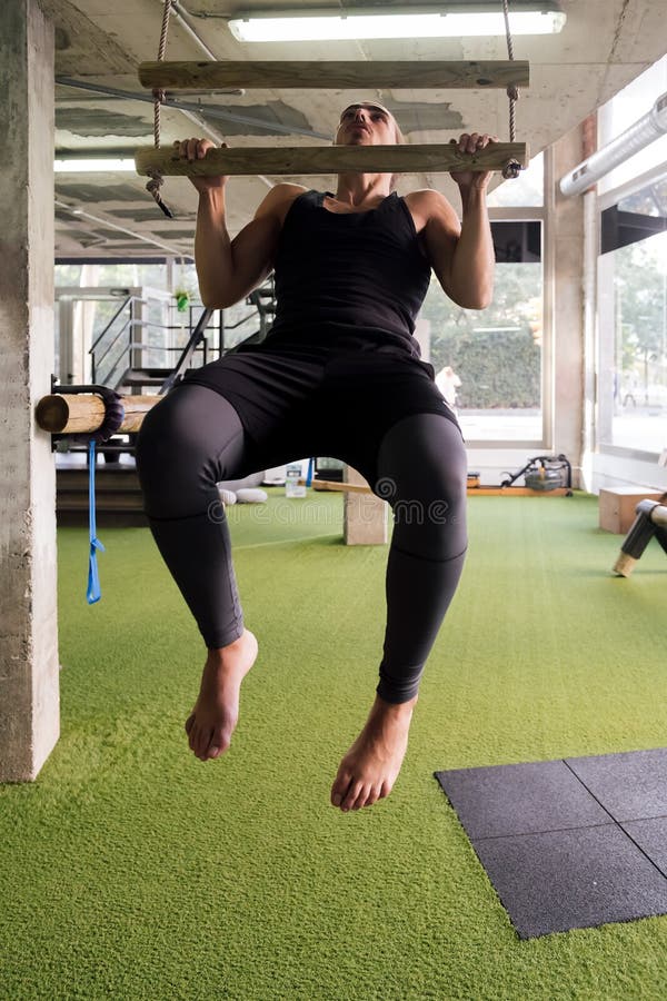 Athlete Trains Strength Doing Pull Ups at the Gym Stock Image - Image ...