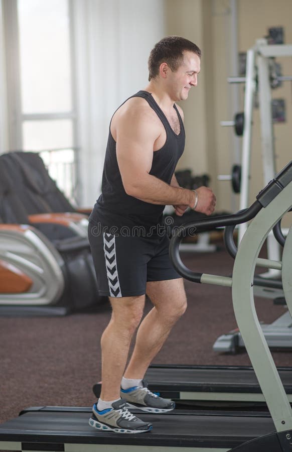 Athlete on the treadmill stock photo. Image of activity - 54730372