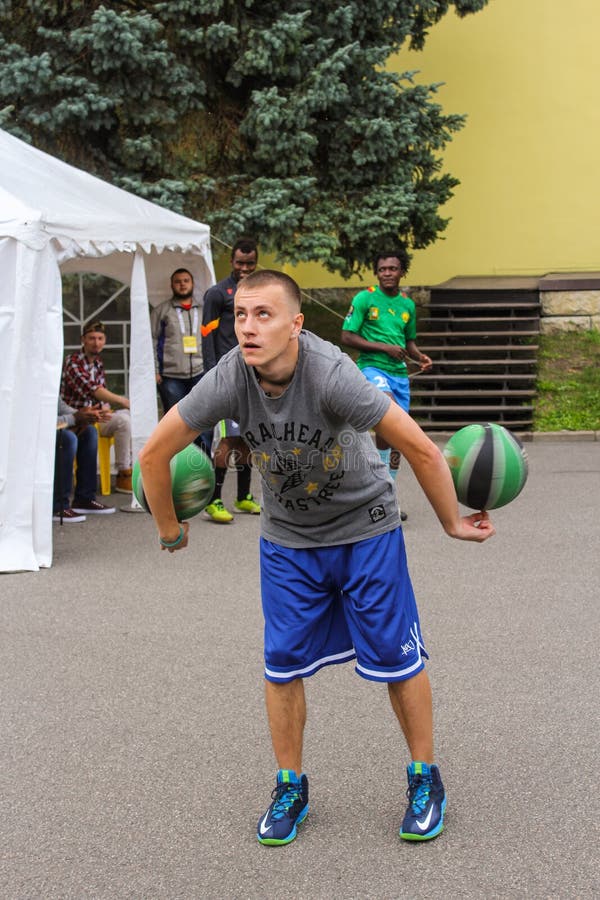 An athlete with two balls. editorial stock image. Image of action ...