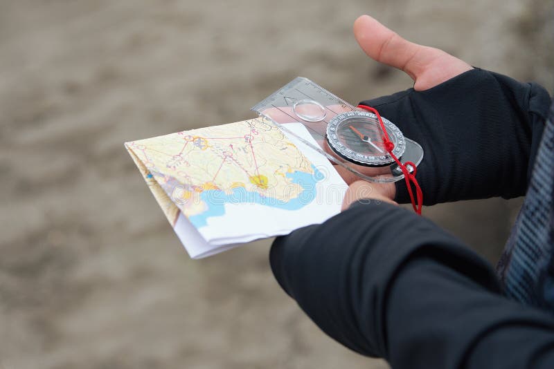 Athlete Uses Navigation Equipment for Orienteering,compass and ...