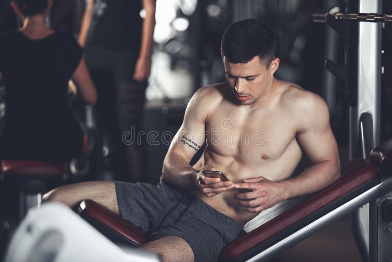 Athlete is Using Phone in Gym Stock Image - Image of bodybuilder ...