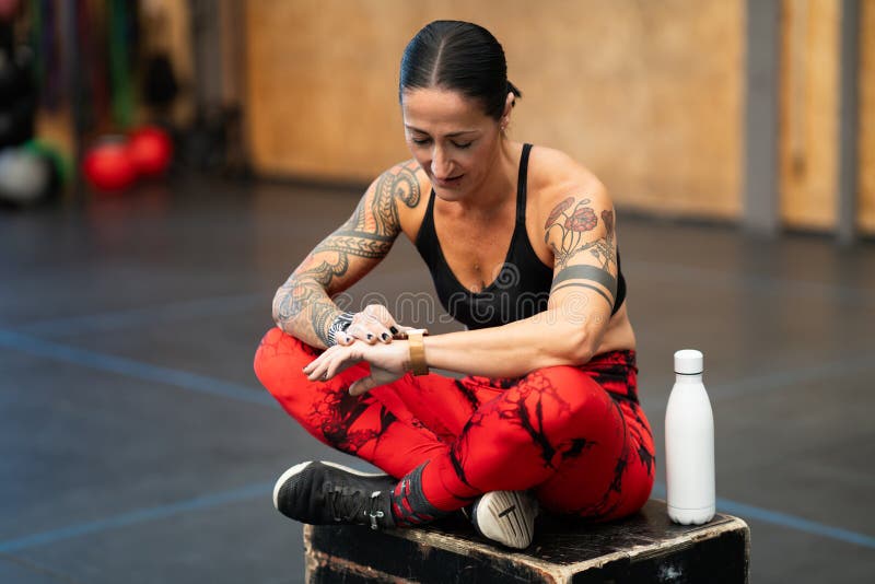 Athlete Using a Smart Watch in a Cross Training Center Stock Photo ...