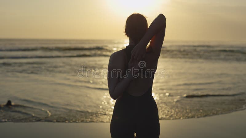 Athlete Will Do Exercise for the Hands, Using Lock To Stretch the Arms ...