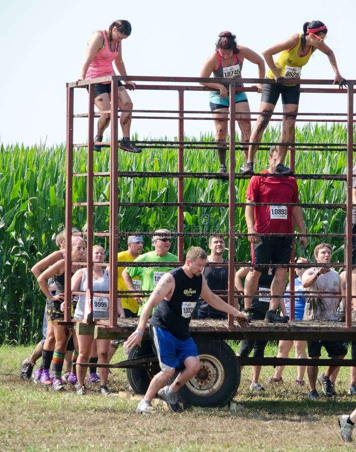 Athletes Climb Over Obstacles at Mudathlon Editorial Stock Photo ...