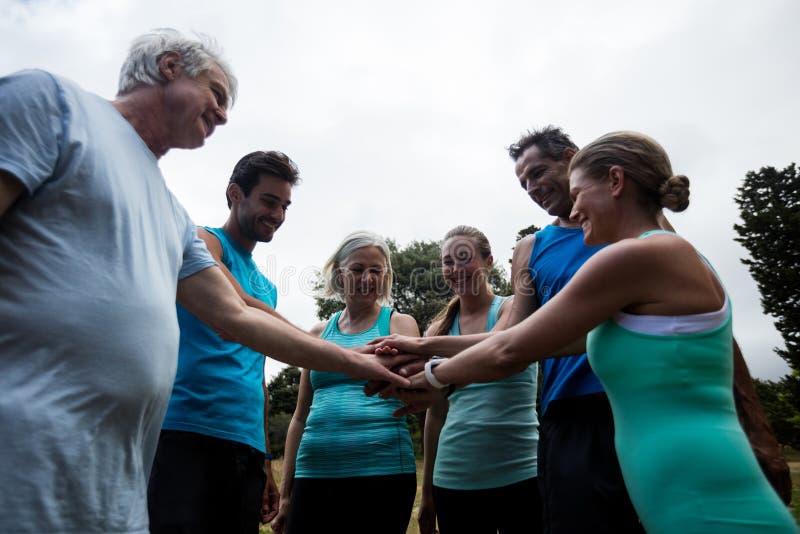 Athletes Doing a Hand Stack in Park Stock Image - Image of ...