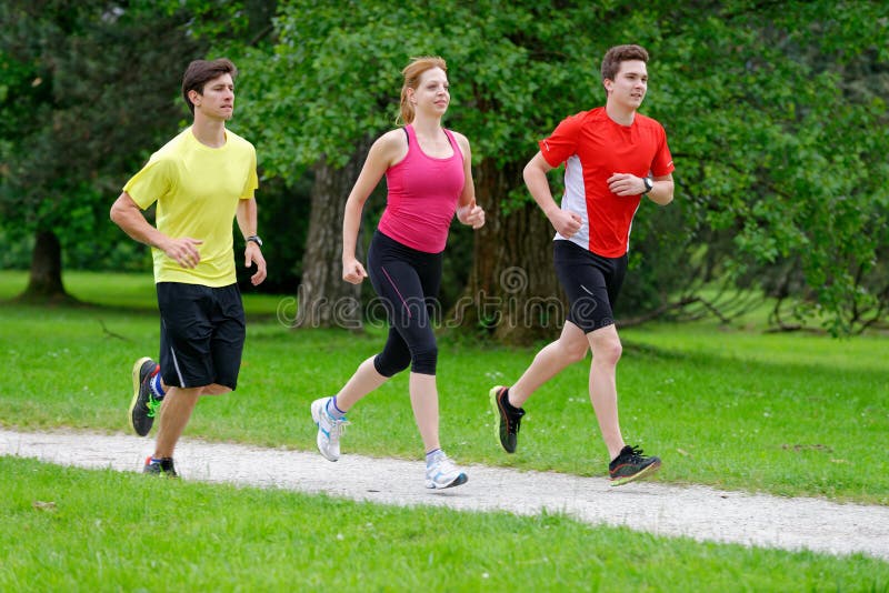 Athletes Jogging in the Park Stock Photo - Image of male, effort: 32761262