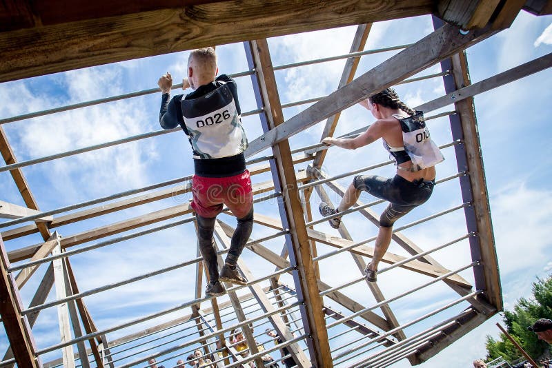 Athletes Overcome Obstacles in the Adventure Race Editorial Image ...