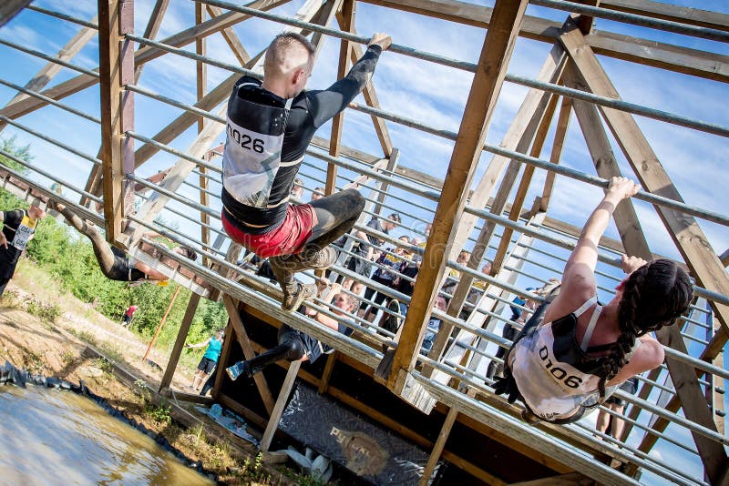 Athletes Overcome Obstacles in the Adventure Race Editorial Photography ...