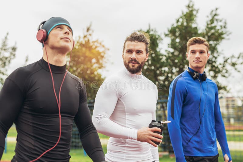 Athletes Practicing a Run on Athletics Stadium Track. Stock Photo ...