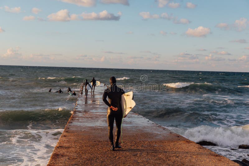 Athletes Riding a Surfboard on the Sea Waves Stock Image - Image of ...
