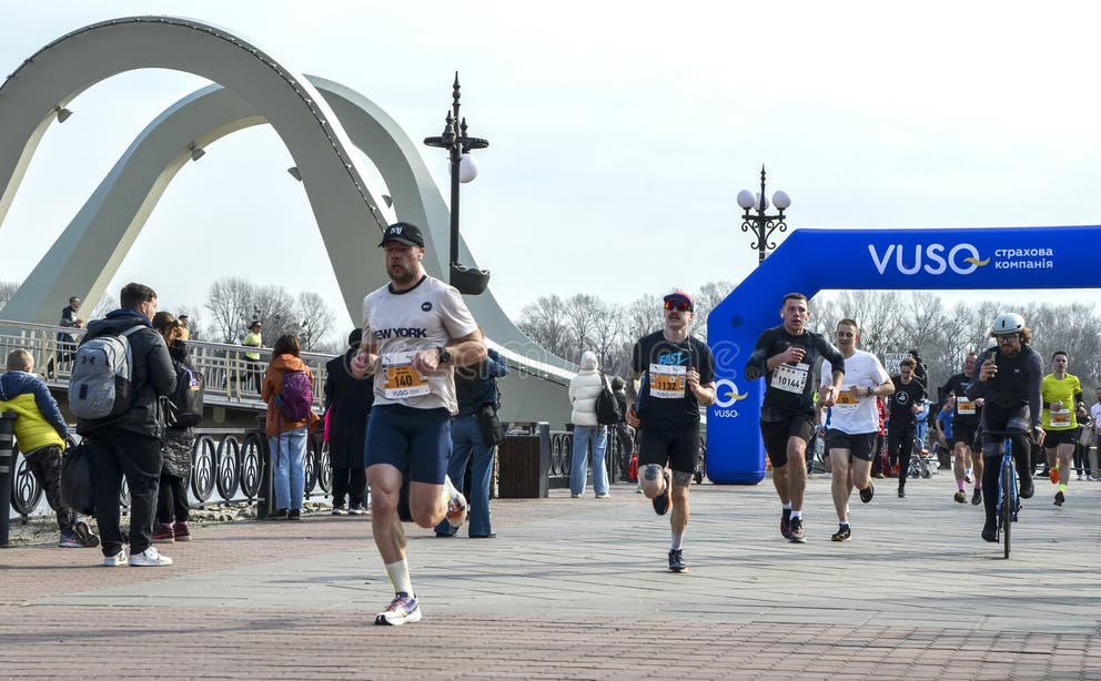 Athletes Running in Marathon Event on a Paved Pathway by Distinctive ...