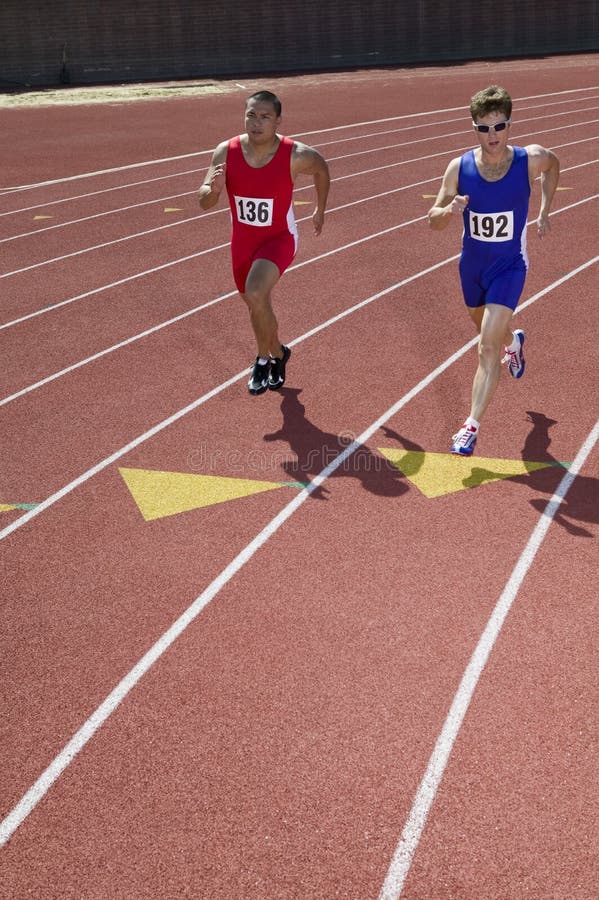 Athletes Running on Race Track Stock Image - Image of full, number ...