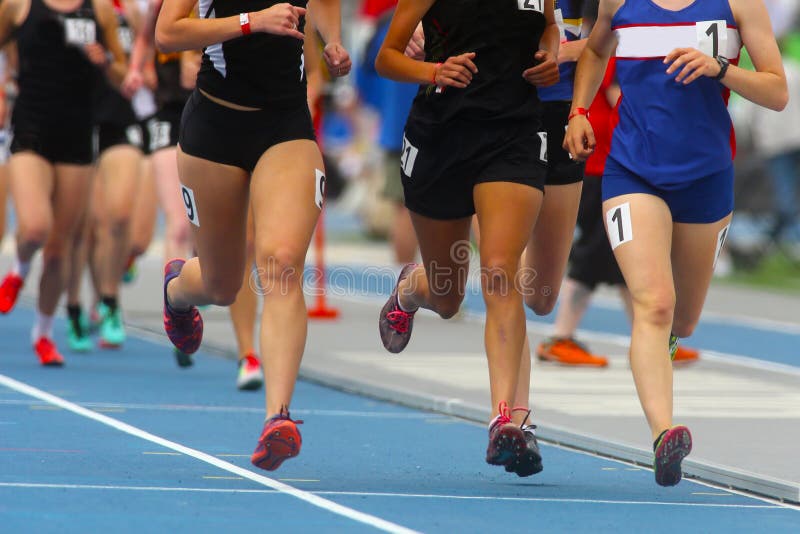 Athletes Running Side-by-Side Stock Photo - Image of exercising, field ...