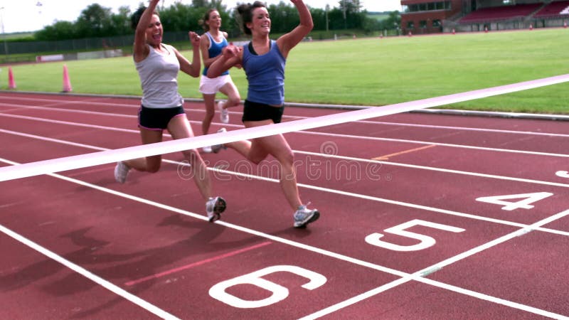 Three Athletes Running Towards the Finish Line Stock Video - Video of ...