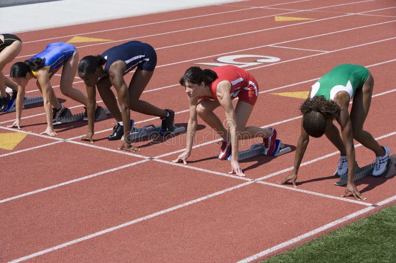 Athletes At Start Of Running Track Stock Image - Image of event, adult ...