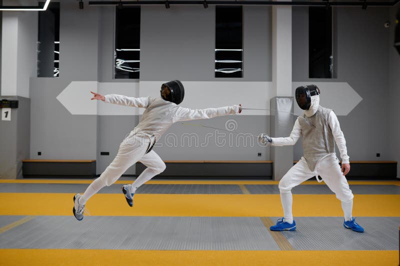 Swordsman Standing in Fencing Lunge during Training Fight in Fencer ...