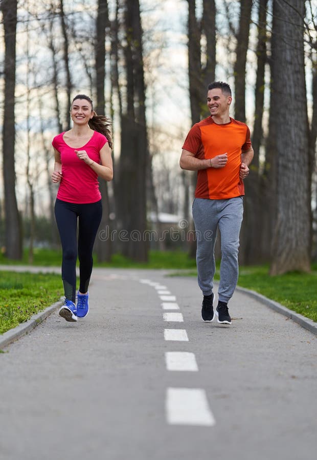 Young Couple Running in the Park Stock Image - Image of lifestyle ...