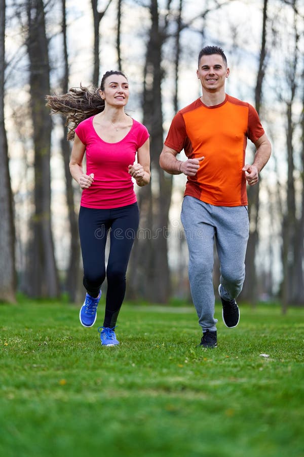 Young Couple Running in the Park Stock Image - Image of recreation ...