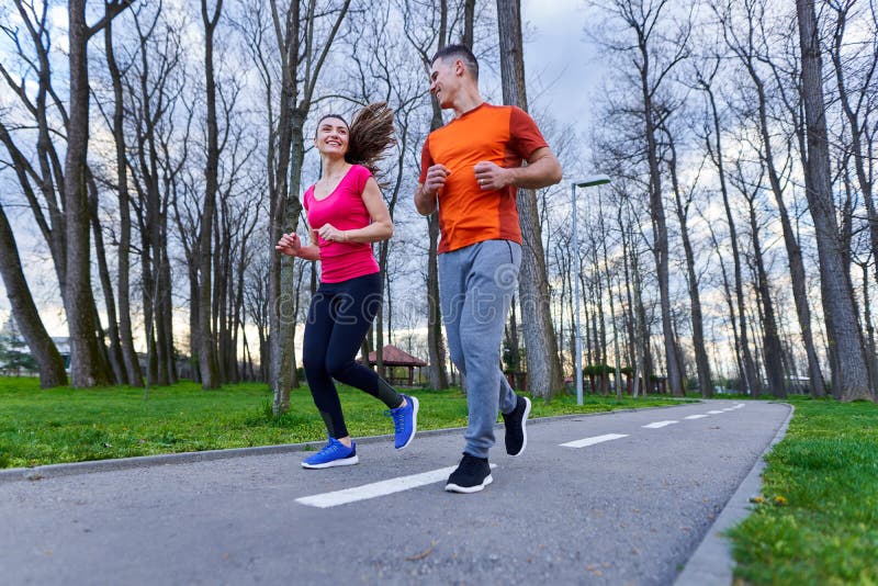Young Couple Running in the Park Stock Photo - Image of athletic ...