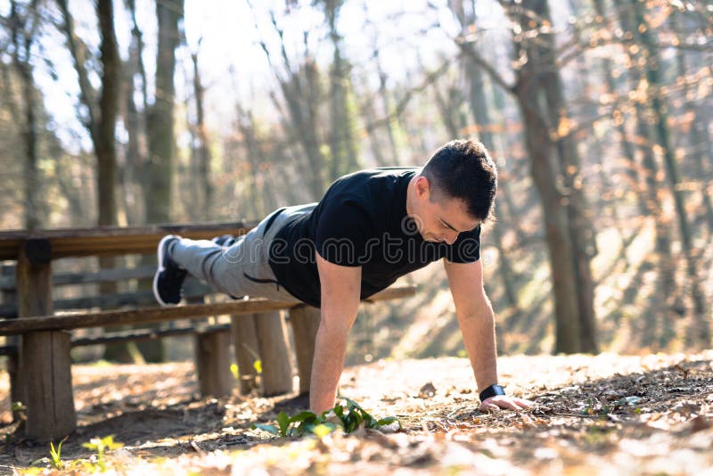 Athletic Built Man Doing Pushups and Core Training in Park Stock Image ...