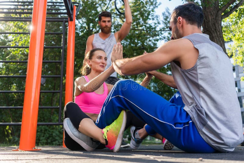 Two Young Men Clapping Hands from Plank Position during Partner Workout ...