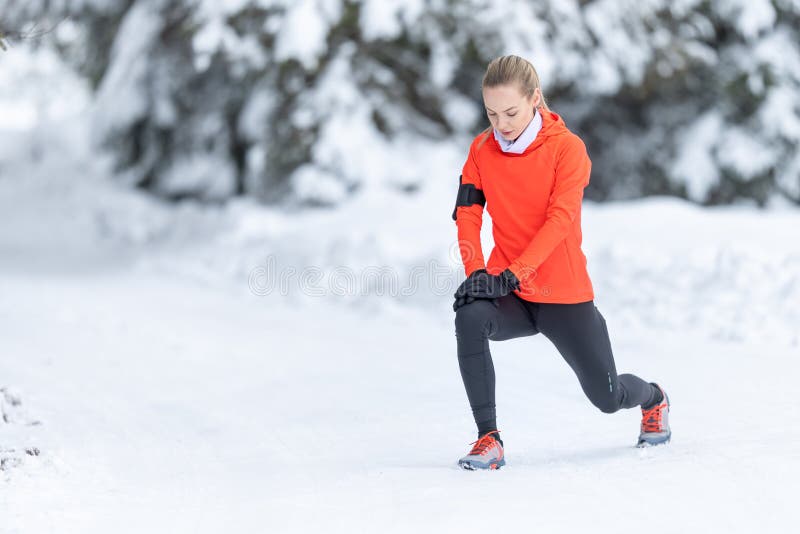 Athletic Female Runner Doing Stretching Exercise, Preparing for Workout ...