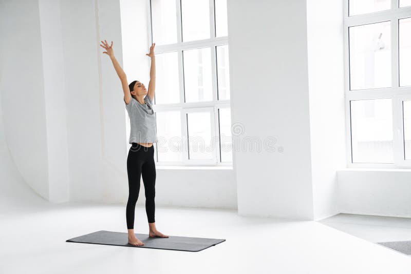 Athletic Focused Sportswoman Doing Exercise during Yoga Practice Stock ...