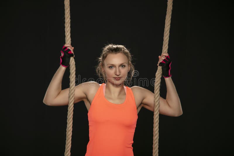 Athletic Girl Exercising with a Thick Rope Stock Image - Image of ...