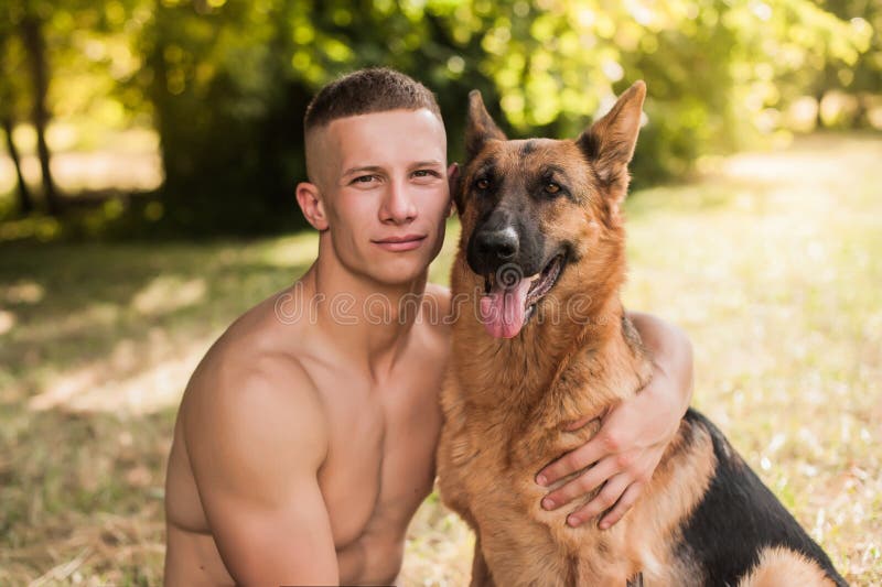 Athletic Guy with a German Shepherd Stock Image - Image of park, model ...