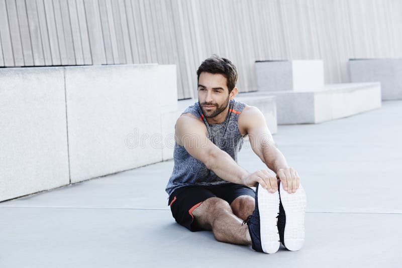 Athletic guy stretching stock photo. Image of person - 80128916