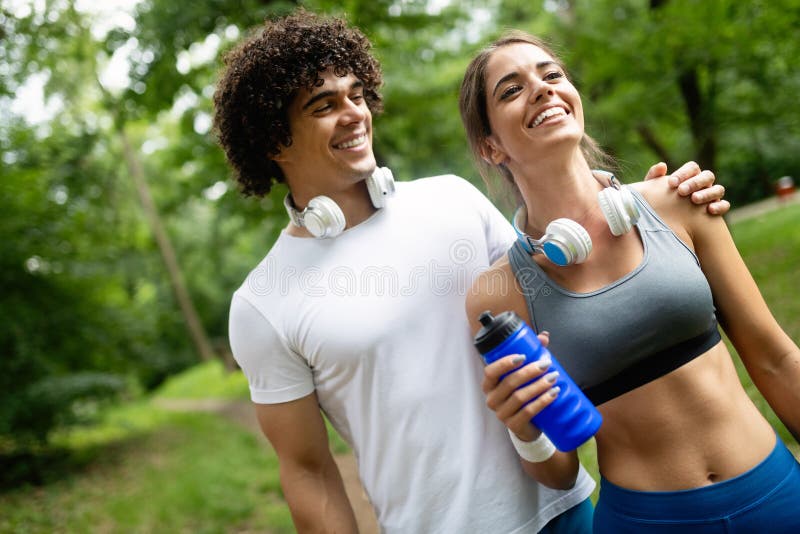 Athletic Couple Friend Drinking Water after Running Stock Photo - Image ...