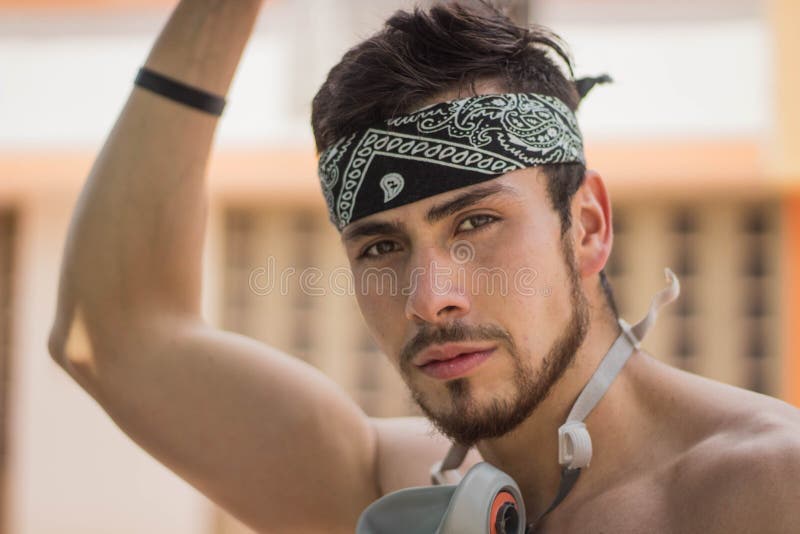 Athletic Male with a Face Mask Working Out on a Field during the Day ...