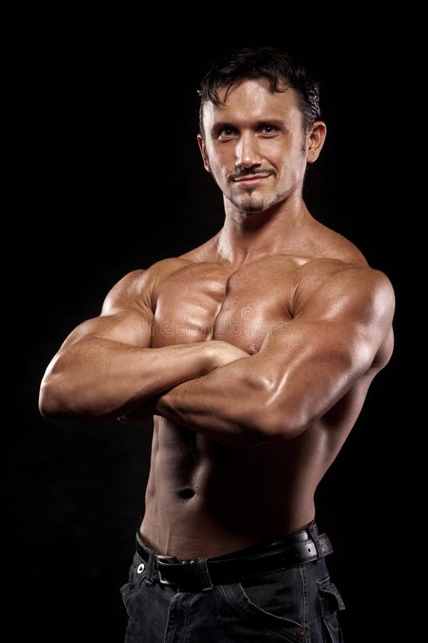 Strong Athletic Man on Dark Background Stock Image - Image of muscle ...