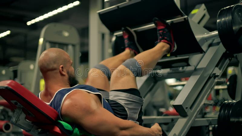 Athletic Man Beard Performs Leg Exercises in Modern Gym. His Focused ...