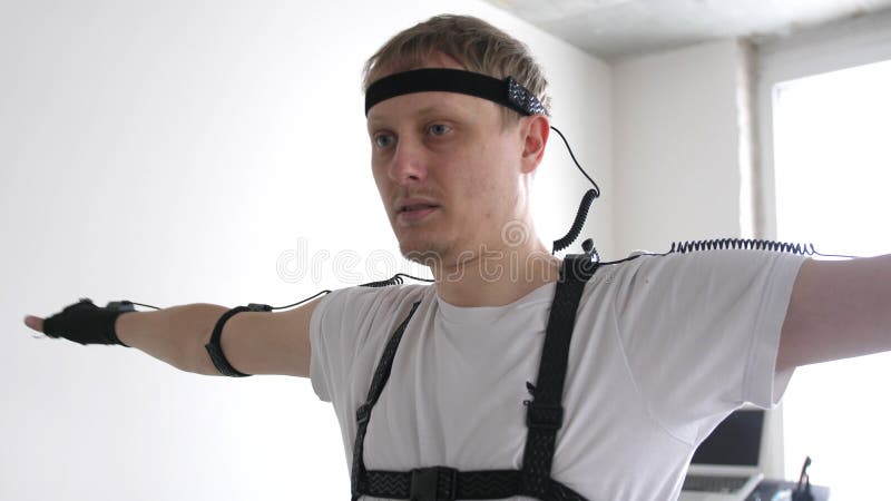 Athletic Man with Beard Wears Motion Capture Suit with Sensors Headset ...