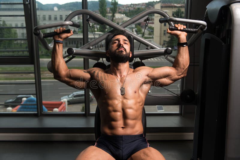 Athletic Man Doing Exercise for Back in Gym Stock Photo - Image of ...